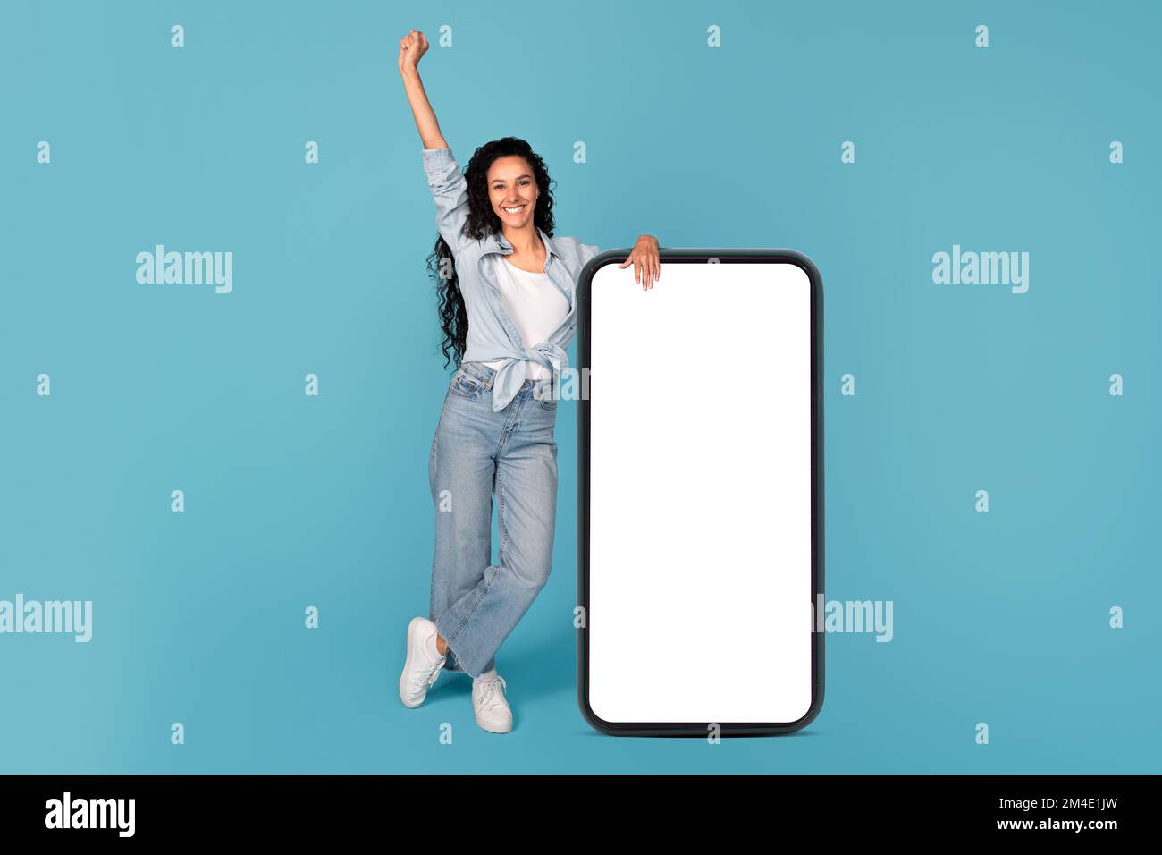 Female hand raises smartphone hi-res stock photography and images - Alamy
