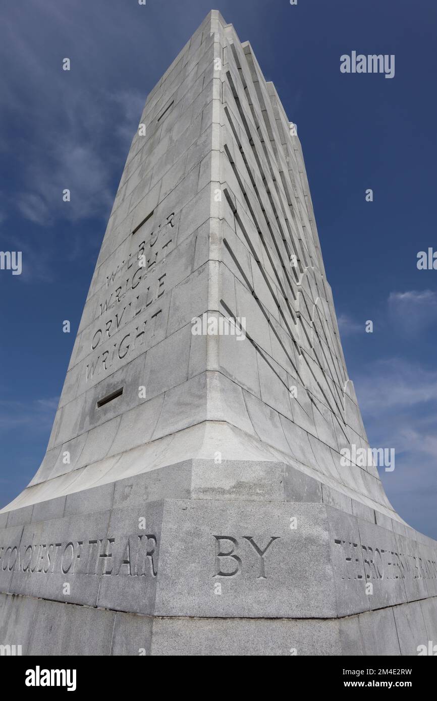 A vertical low-angle shot of the Wright Brothers' monument in Kitty ...