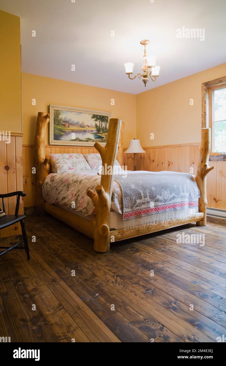 Rustic four poster bed in upstairs guest bedroom with nuanced brown ...