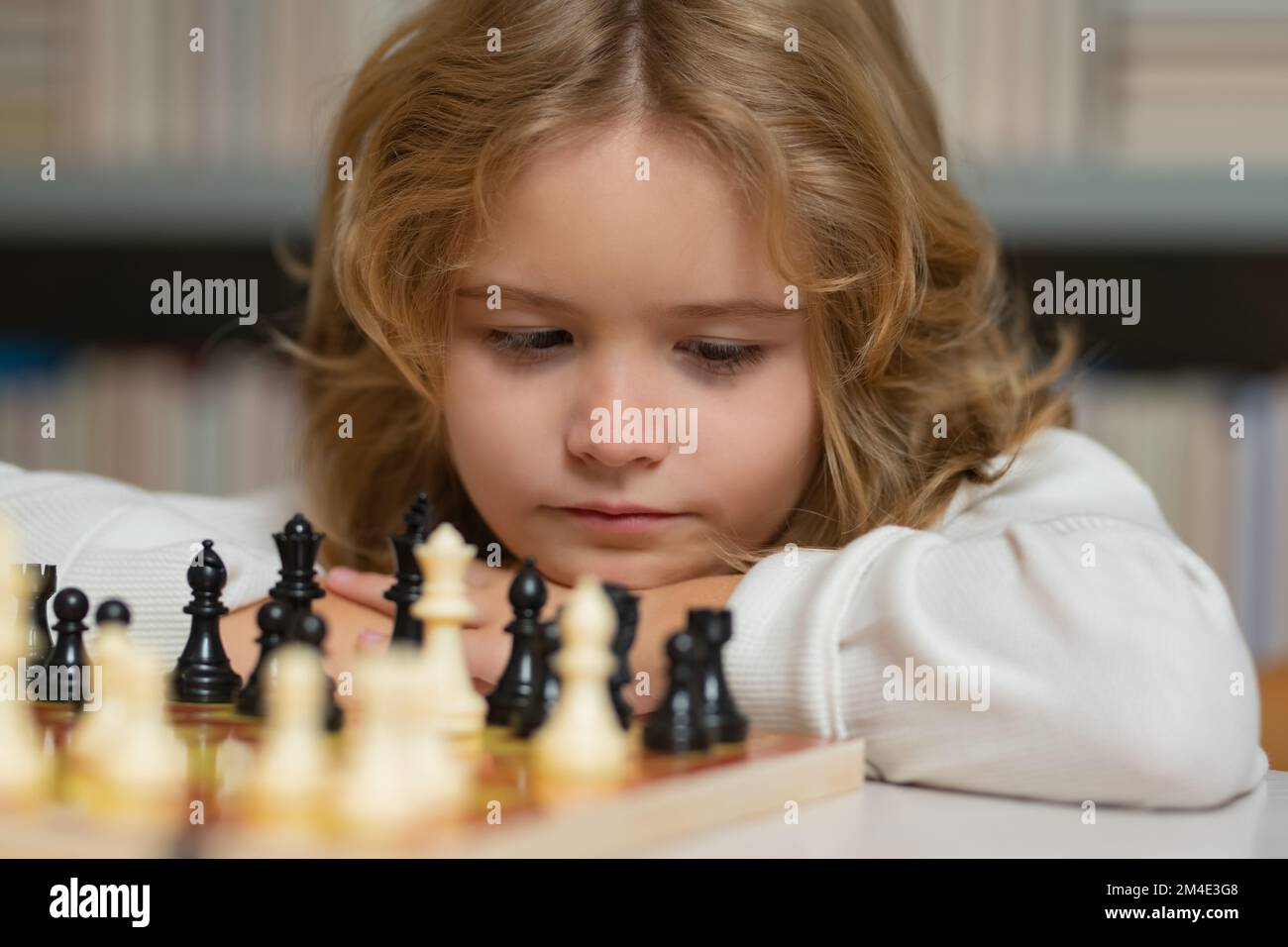 boy and chess, close-up, portrait Early development. Child thinking ...