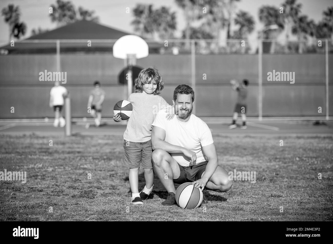 happy daddy and son playing basketball with ball outdoor, fathers day ...