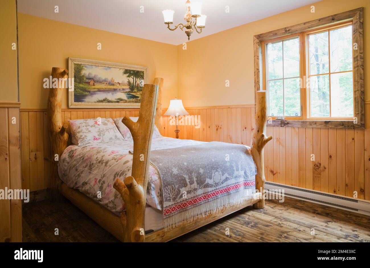 Rustic four poster bed in upstairs guest bedroom with nuanced brown ...