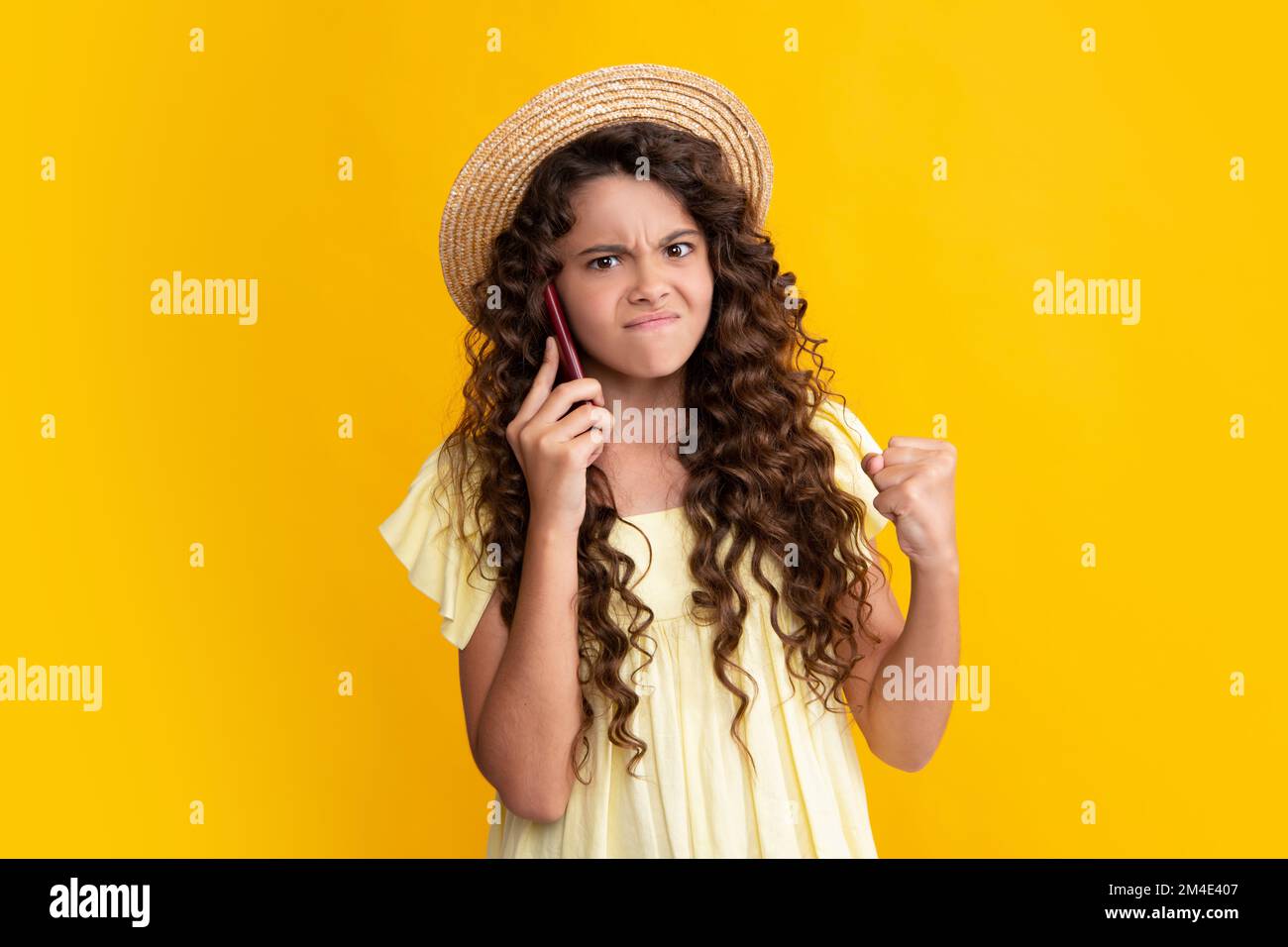 Unhappy sad angry teenager girl child using mobile phone, chatting on ...