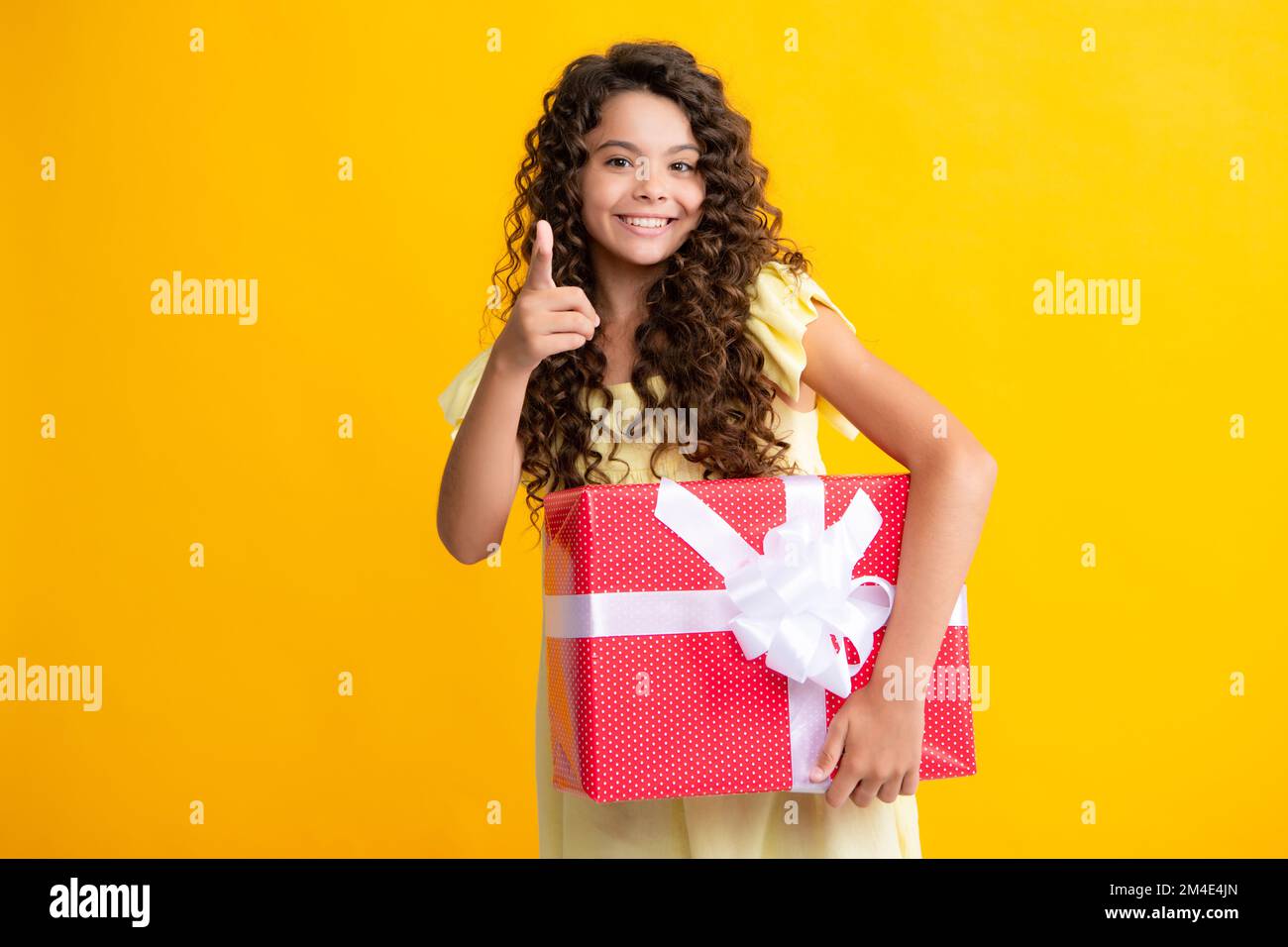 Happy teenager portrait. Child with gift present box on isolated ...