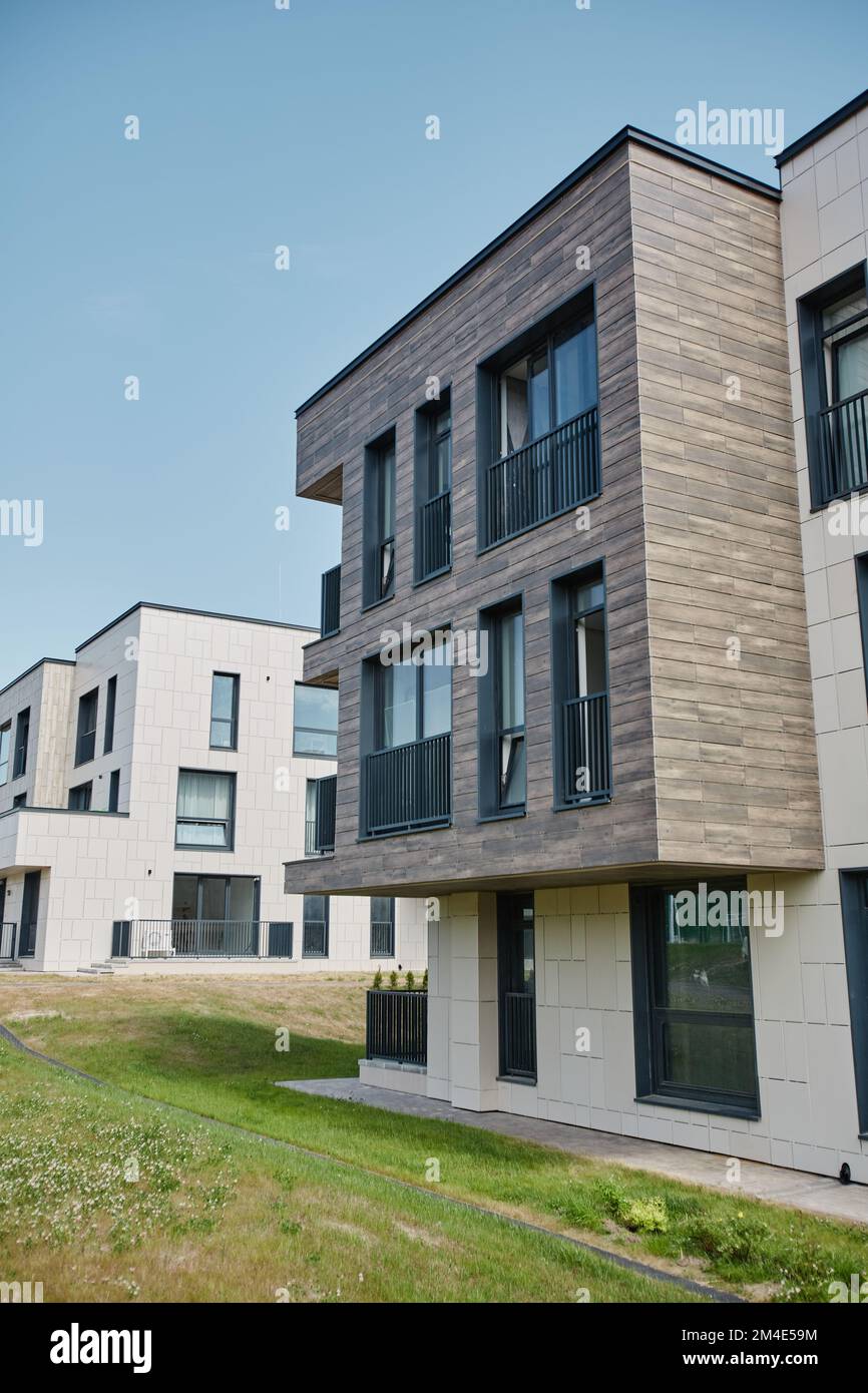 Vertical wide angle shot of apartment buildings in modern housing ...