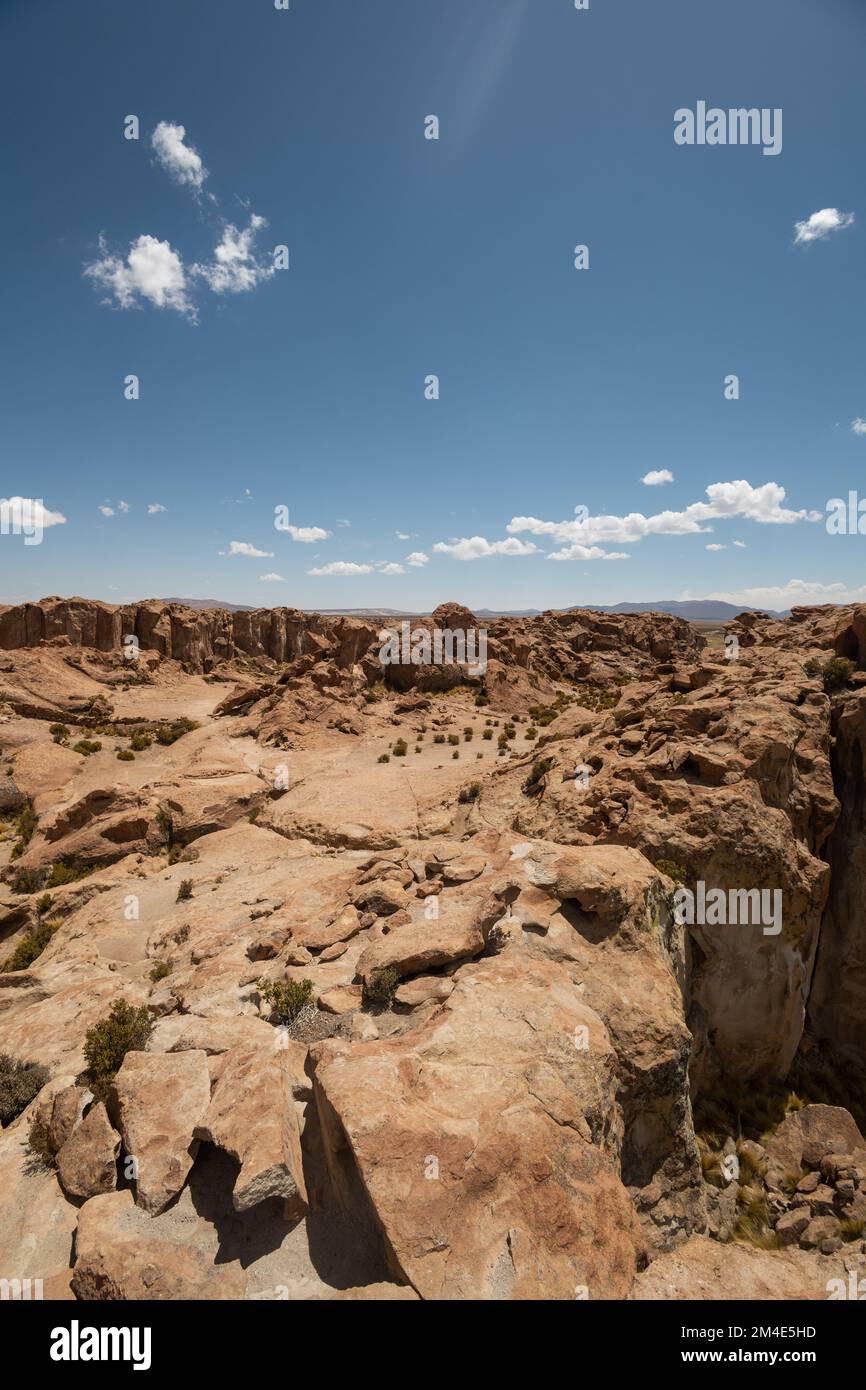 mountains and sky with clouds, detail of floor with rocks, landscape ...