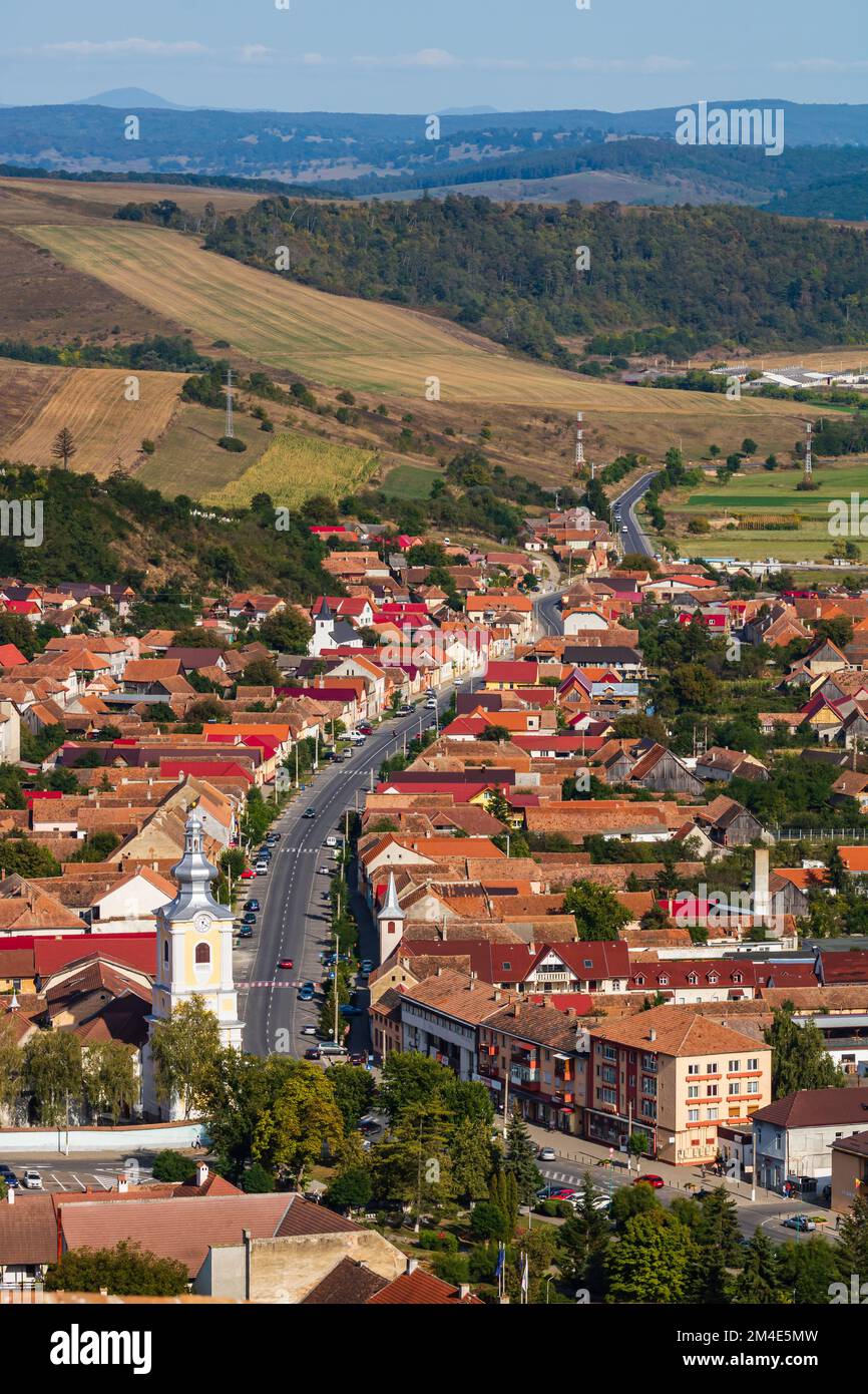 Aerial view of the town center with hills, buildings, streets ...