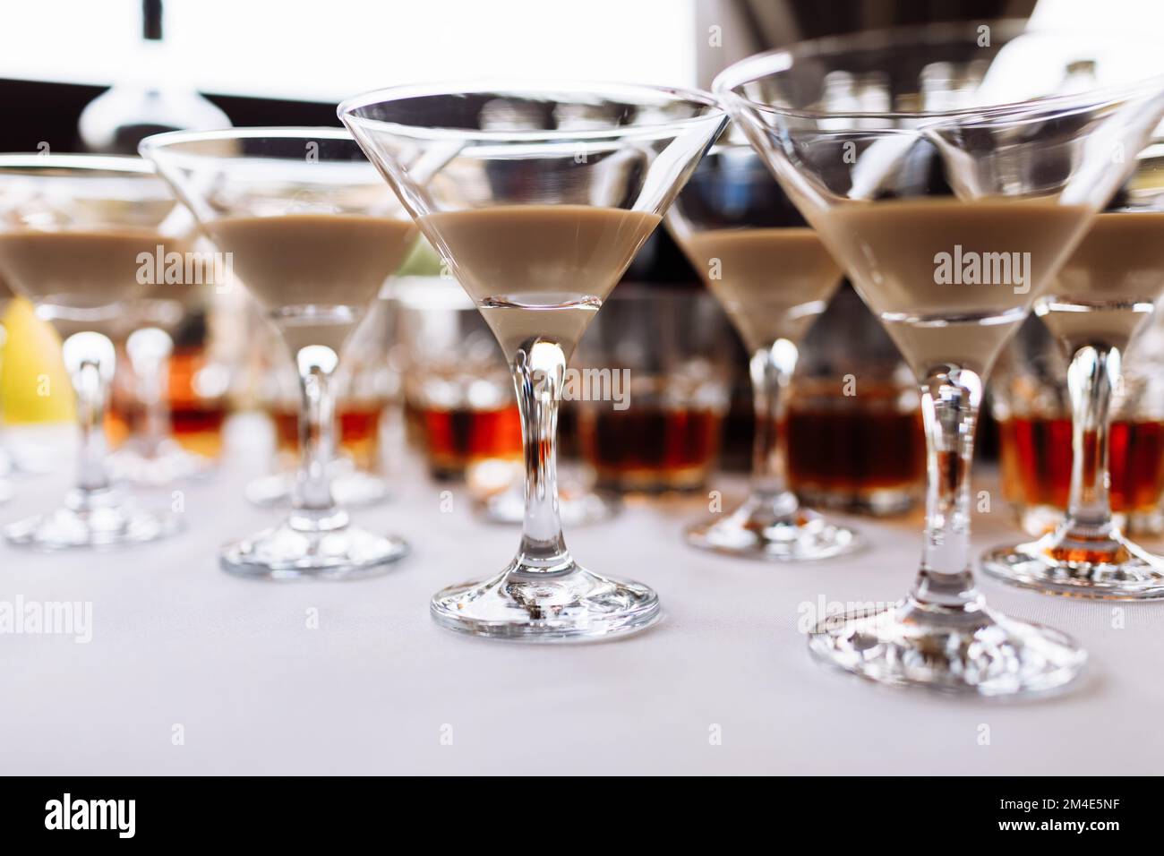 Many martini glasses with alcohol cream coffee irish cocktail, on white ...