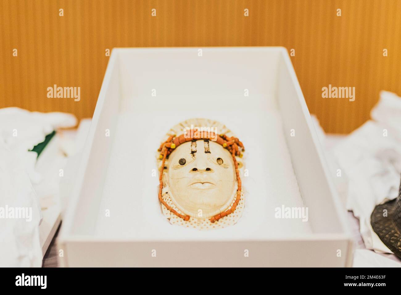 Miniature ivory mask taken during the ceremony to return the Benin ...