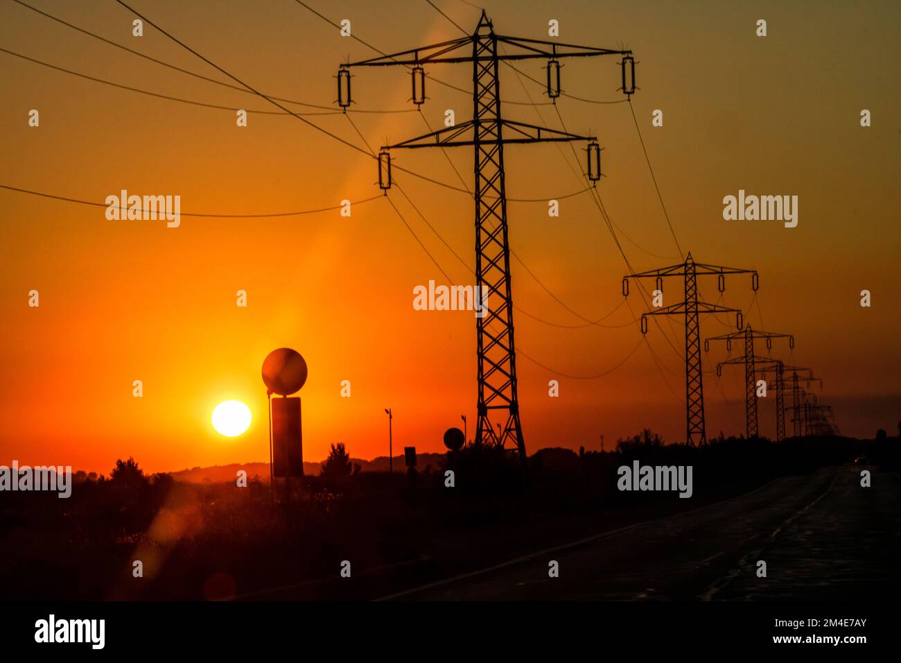 Electric power pylon, electric tower at sunset Stock Photo - Alamy