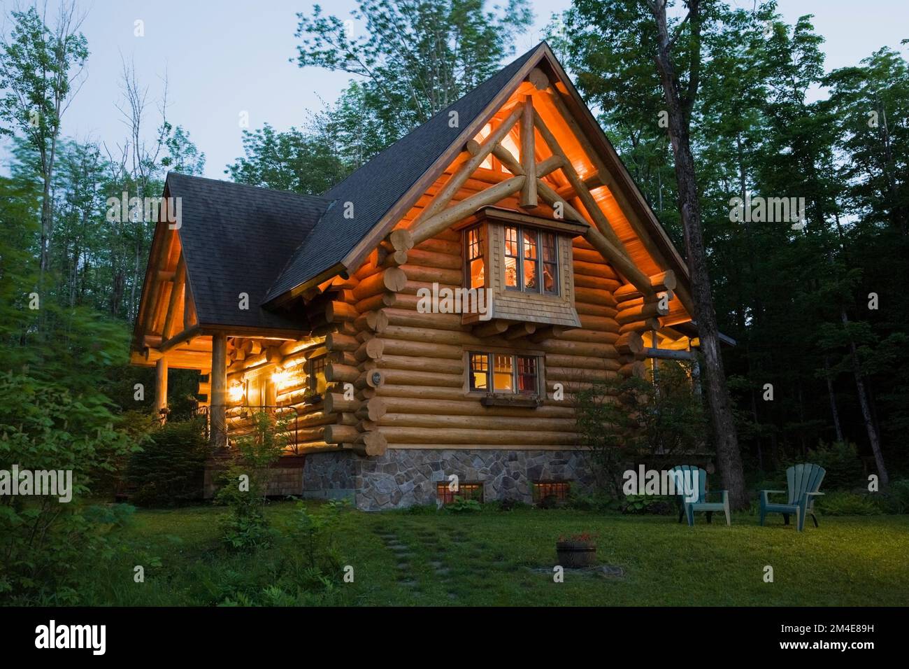 2003 built cottage style log home with brown asphalt shingles roof and ...