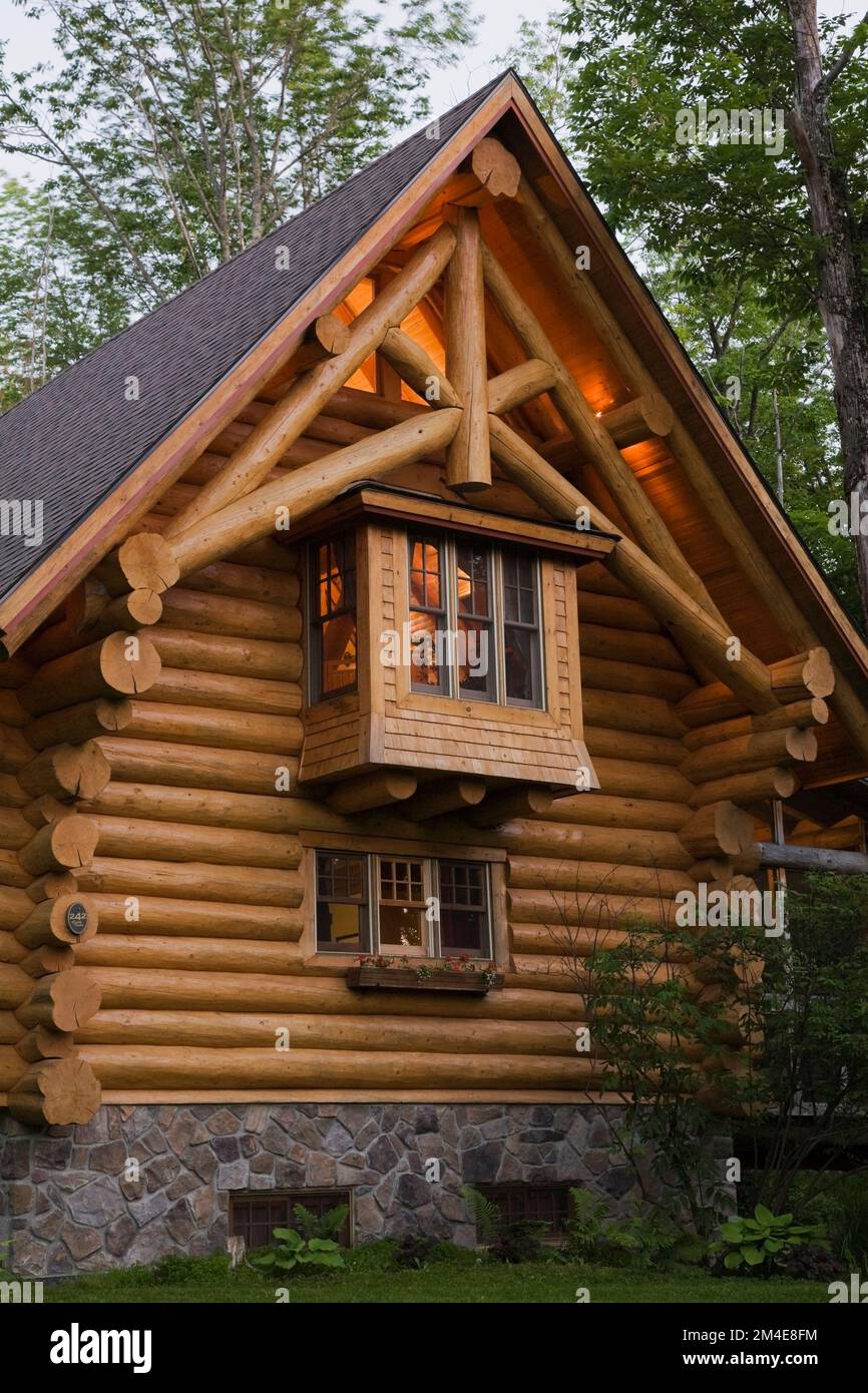 2003 built cottage style log home with brown asphalt shingles roof and ...