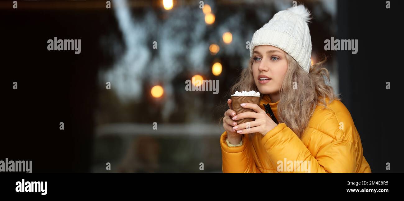 Woman drinking hot chocolate outdoors hi-res stock photography and ...