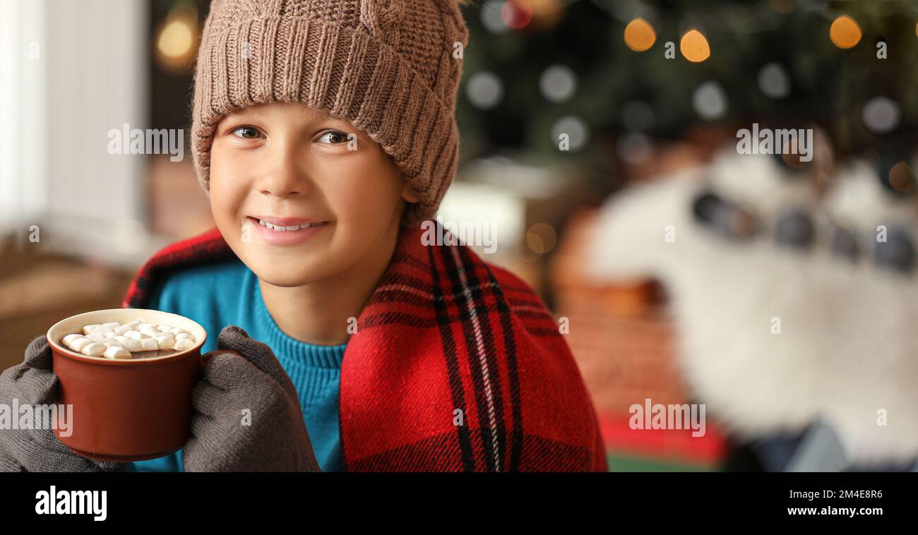 Little boy drinking hot chocolate at home on Christmas eve Stock Photo ...