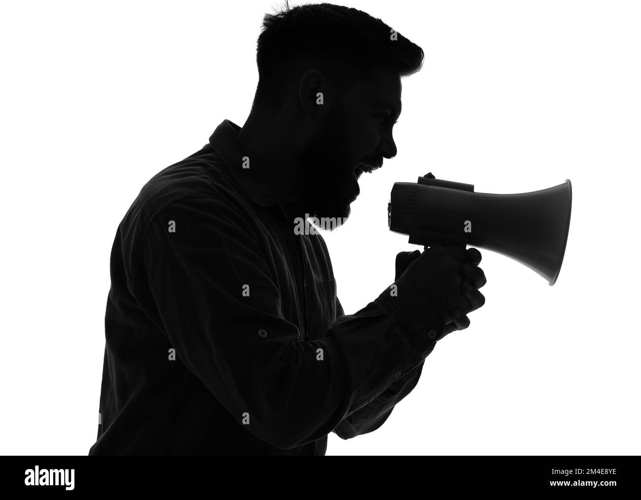 Silhouette of young man shouting into megaphone on white background ...