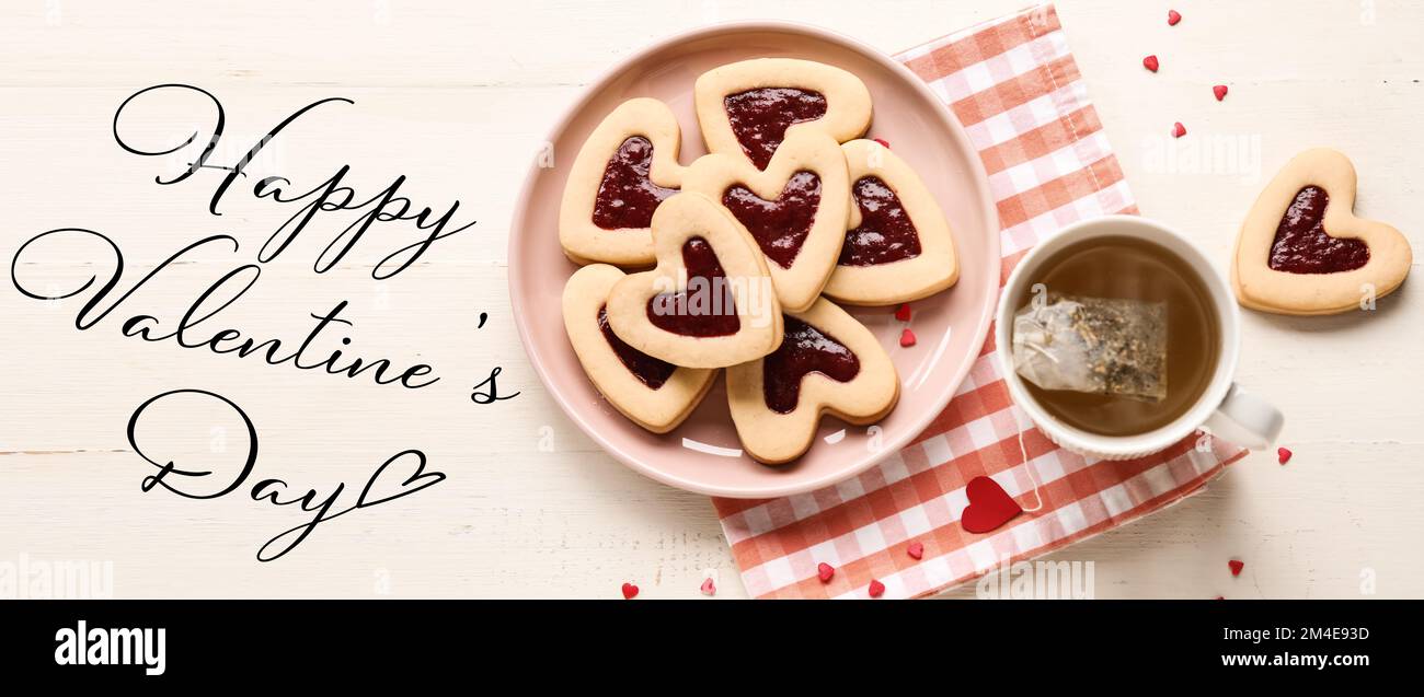 Greeting card for Valentine's Day with tasty cookies and cup of tea ...