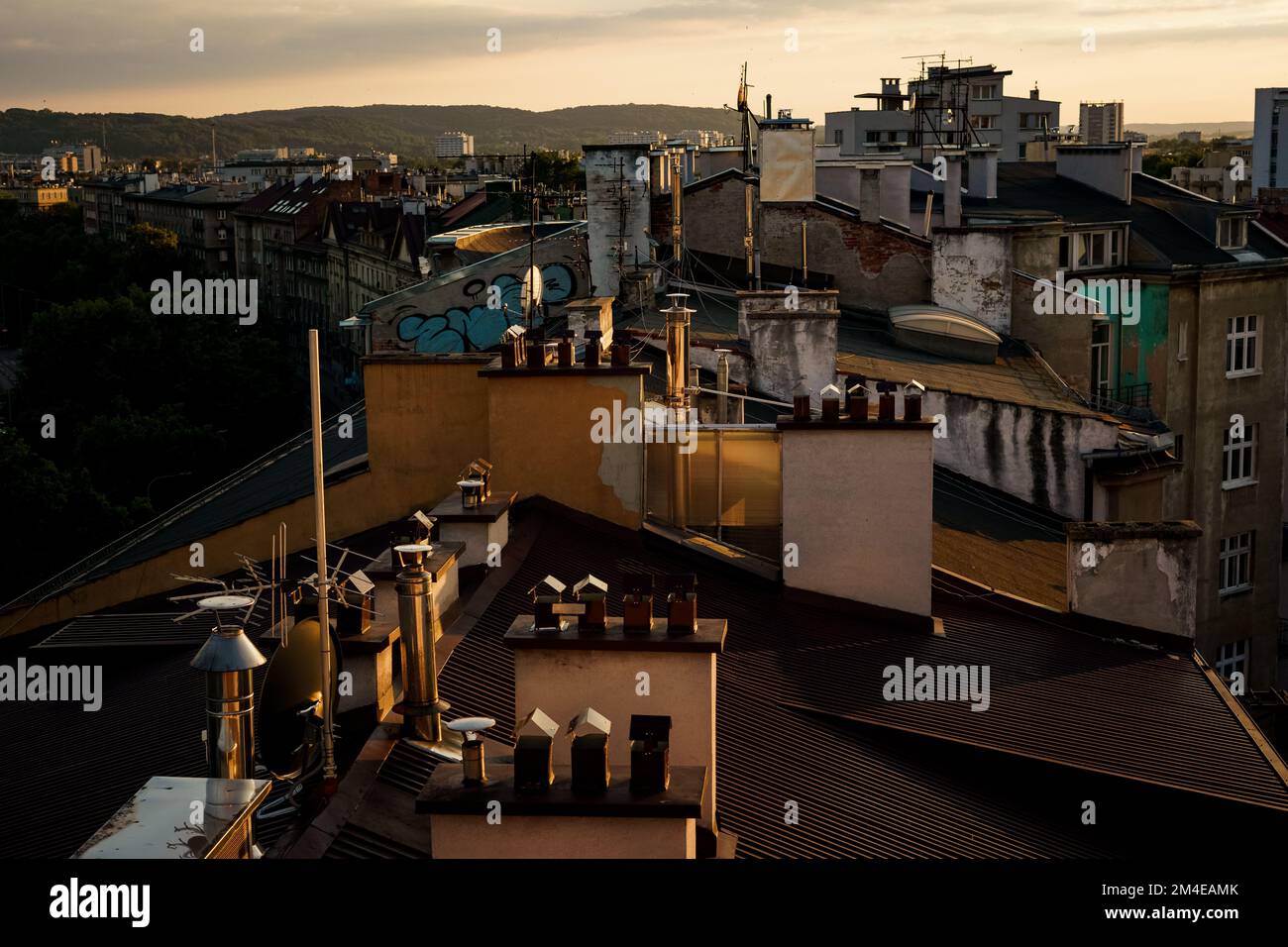 An aerial view of Roofs with a bunch of chimneys during sunset Stock ...