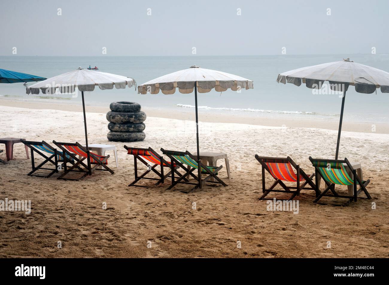 Umbrellas and bed rest on the beach Stock Photo - Alamy
