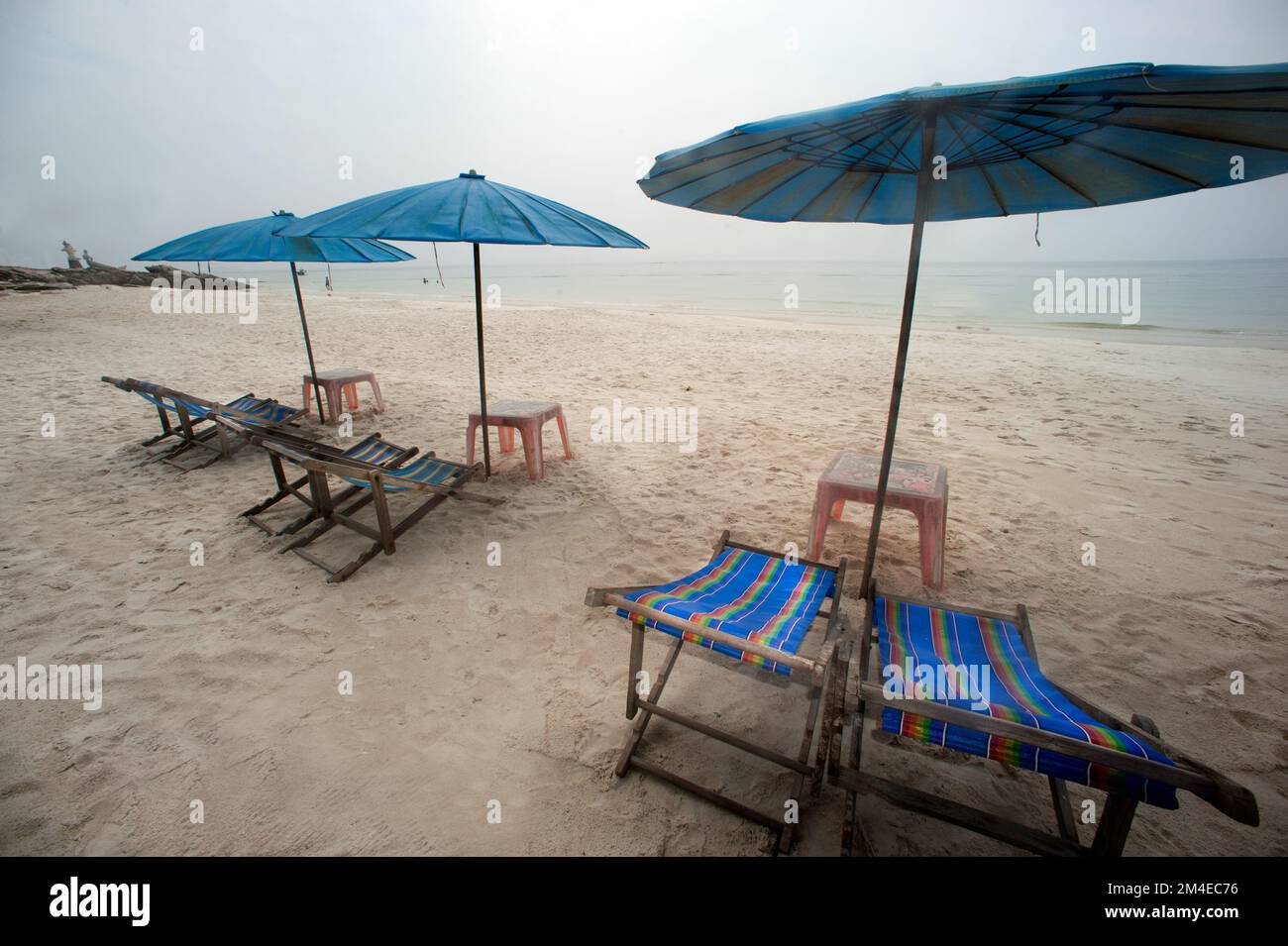 Umbrellas and bed rest on the beach Stock Photo - Alamy