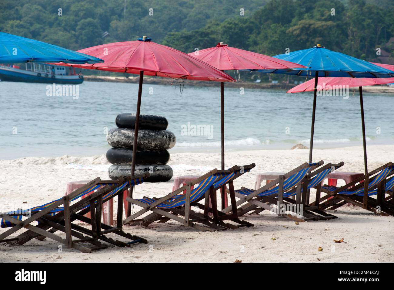 Umbrellas and bed rest on the beach Stock Photo - Alamy