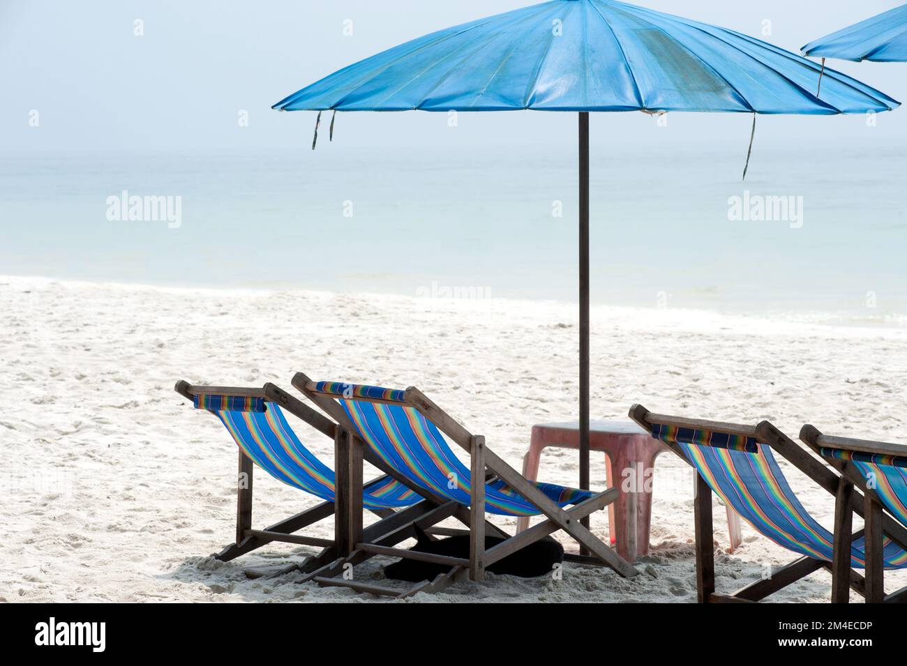 Umbrellas and bed rest on the beach Stock Photo - Alamy
