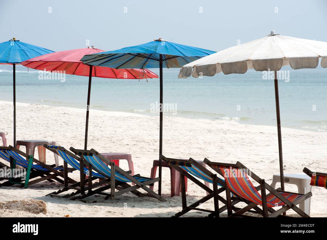 Umbrellas and bed rest on the beach Stock Photo - Alamy