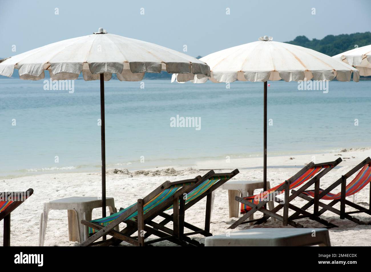 Umbrellas and bed rest on the beach Stock Photo - Alamy