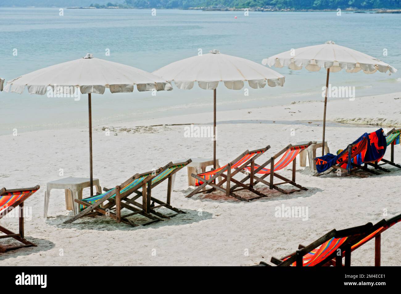 Umbrellas and bed rest on the beach Stock Photo - Alamy