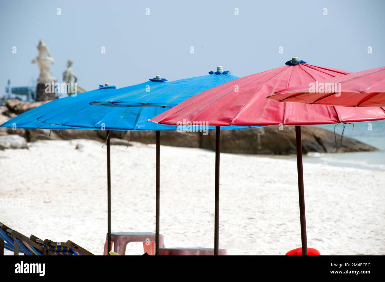 Umbrellas and bed rest on the beach Stock Photo - Alamy
