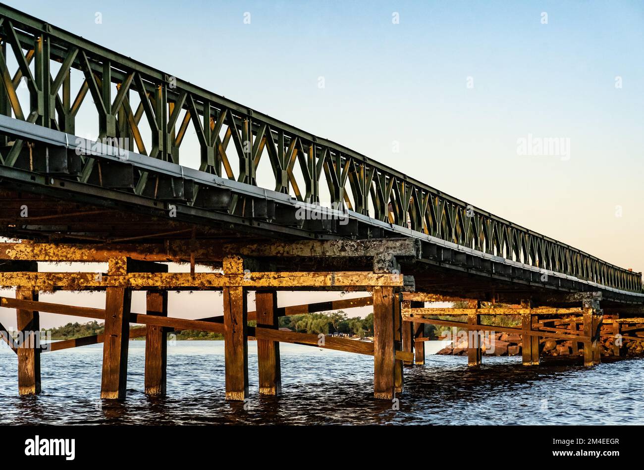 Low angle shot of iron and wooden bridge located in the small town of ...