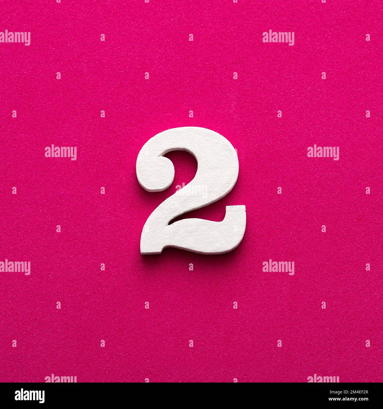 Number 2 - White wooden number on rhodamine red background Stock Photo ...