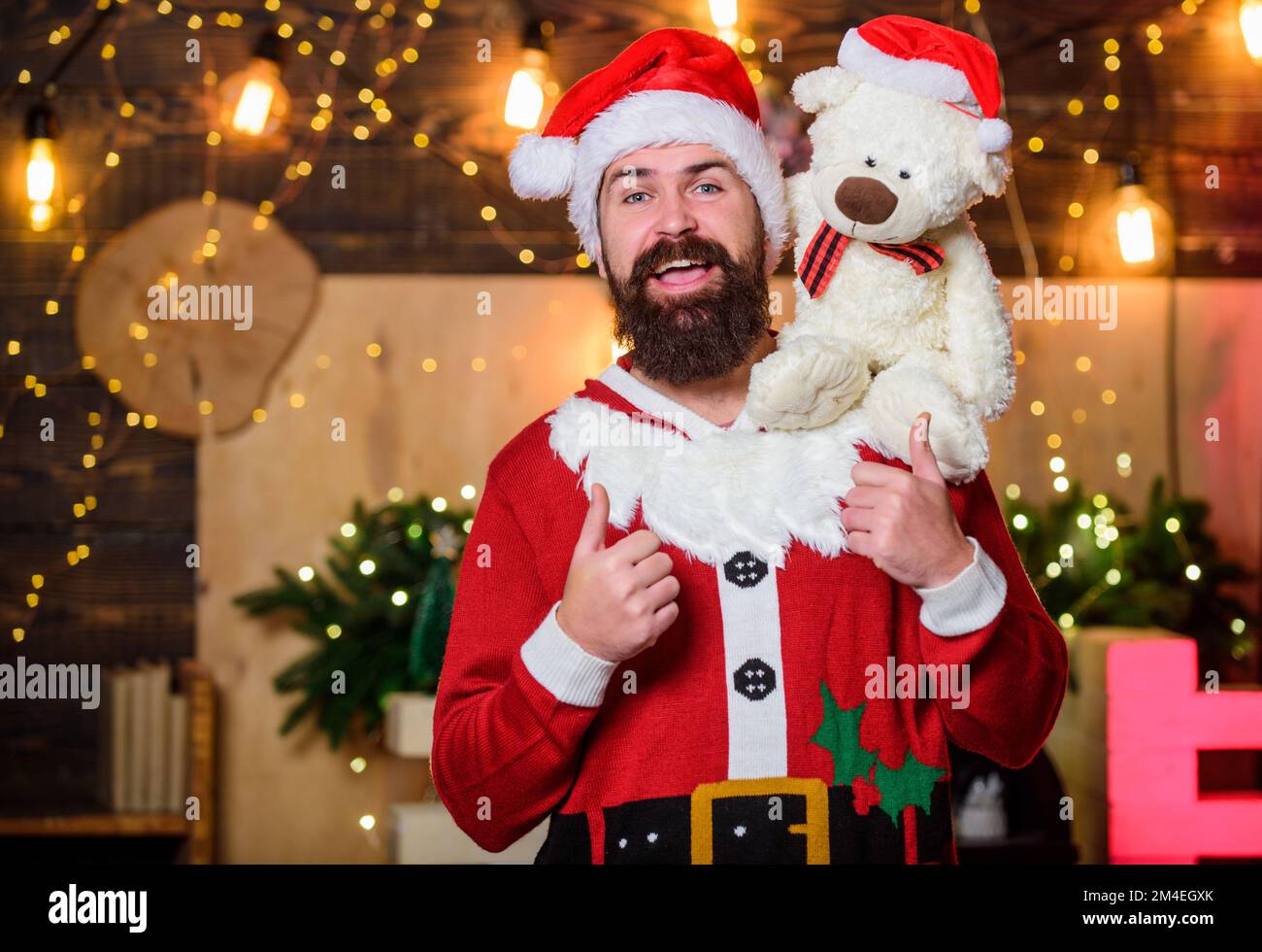 Man bearded Santa claus play with soft toy teddy bear. Christmas ...
