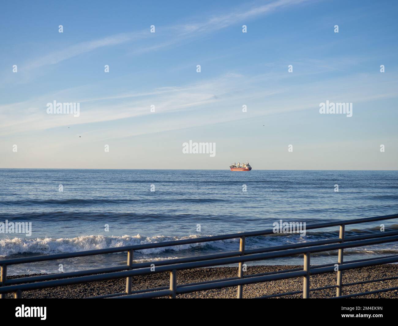 Industrial ship far out to sea. Landscape with a ship. Skyline. Sky and ...