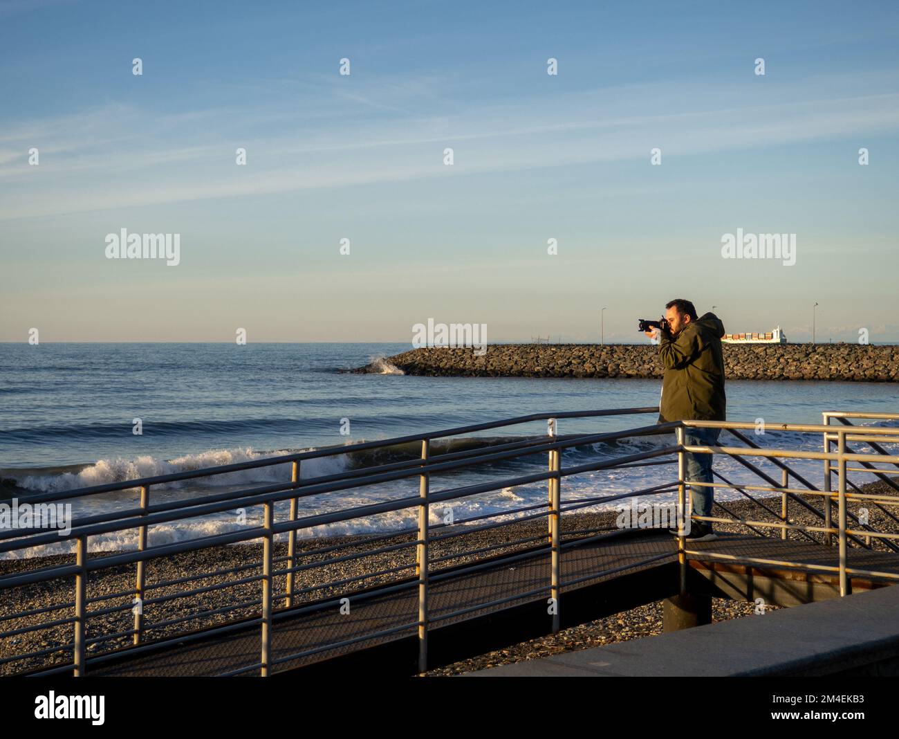 Batumi, Georgia. 11.28.2022 The photographer takes pictures of the sea ...