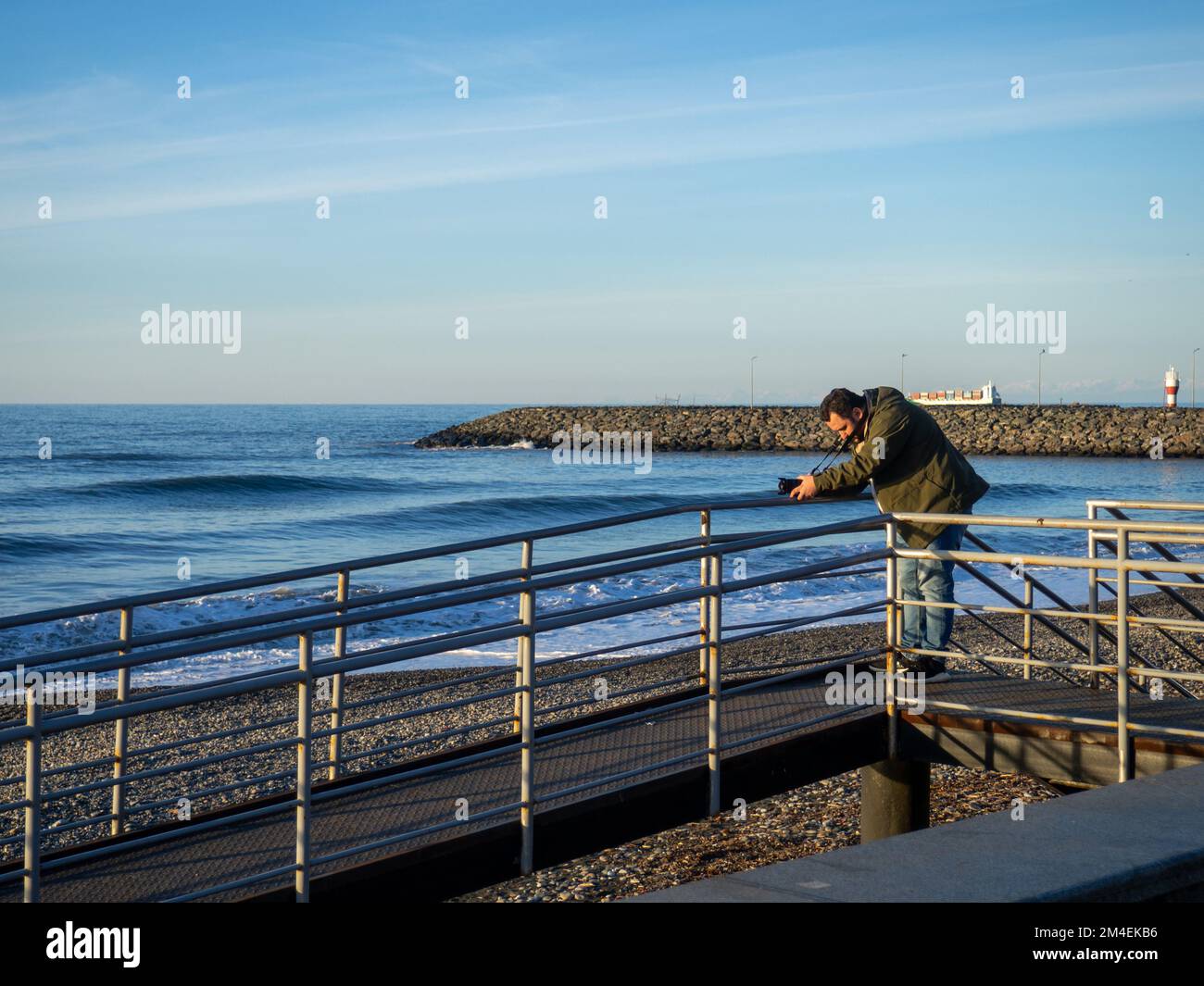 Batumi, Georgia. 11.28.2022 photographer takes pictures of the sea. The ...