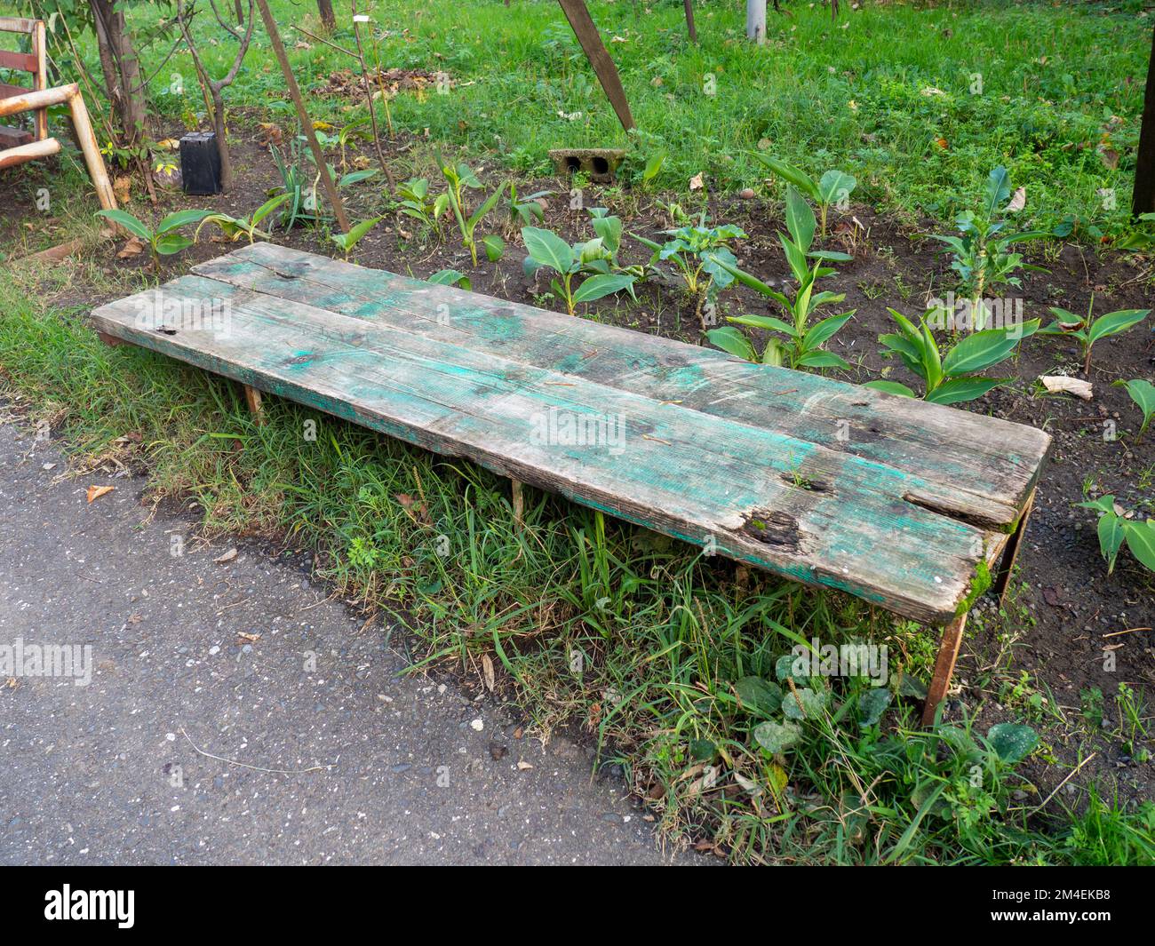 Empty old bench. Old courtyard. Bench made of metal and iron. abandoned ...
