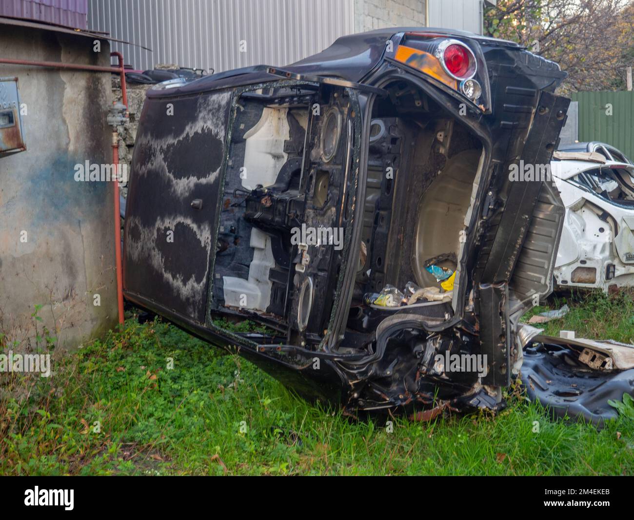Broken cars near the car workshop. Cars in the landfill. A pile of ...