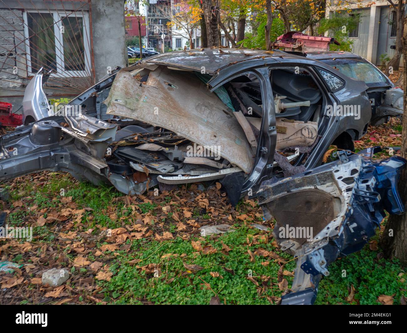 Broken cars near the car workshop. Cars in the landfill. A pile of ...
