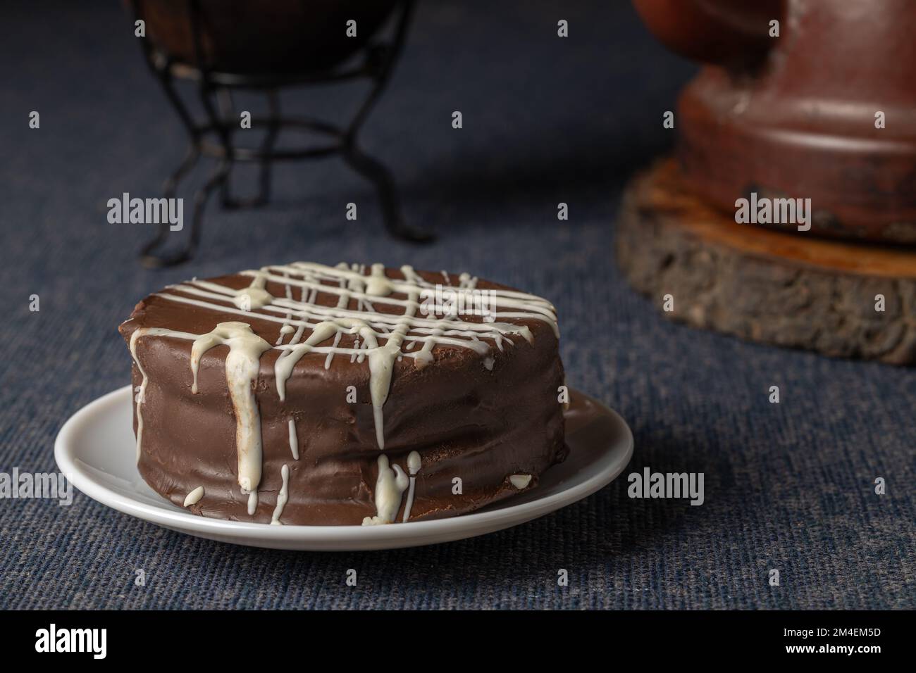 Brown chocolate alfajor, typical candy in Argentina, on dark background ...