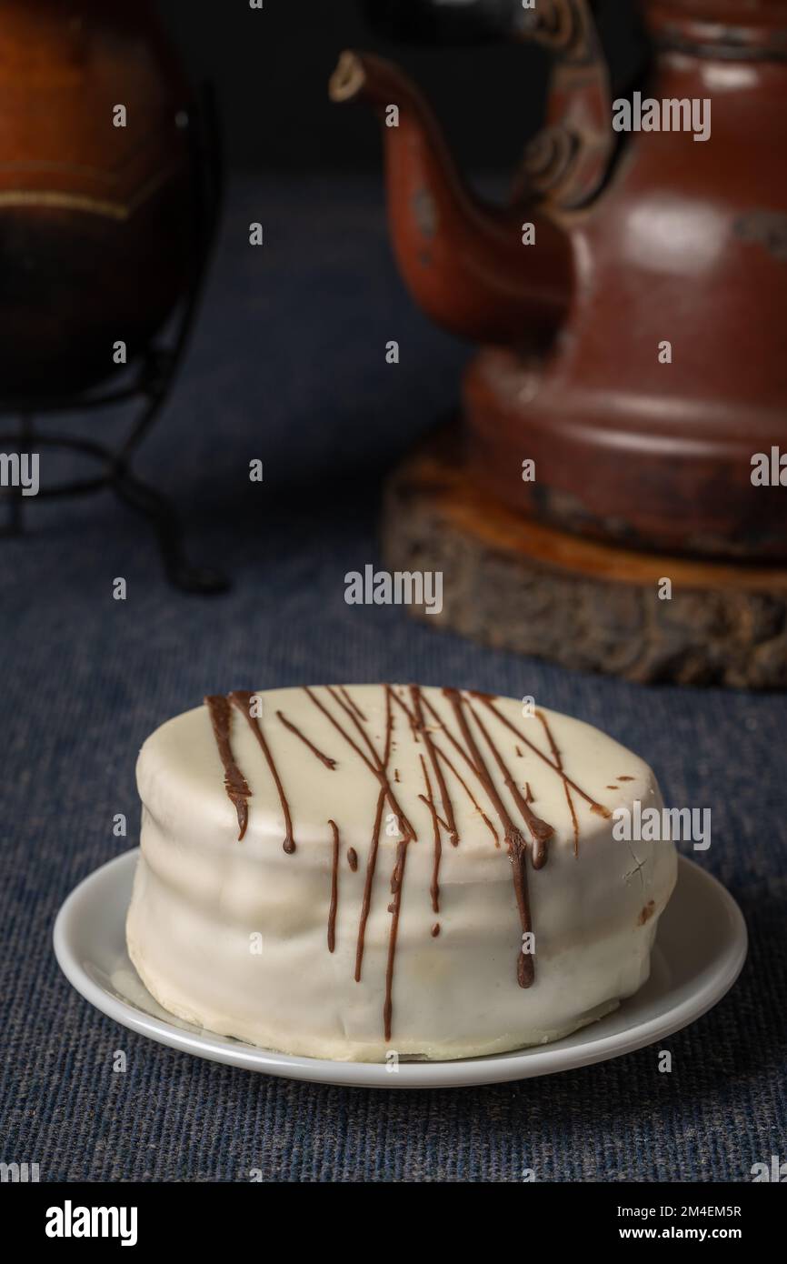 Brown chocolate alfajor, typical candy in Argentina, with yerba mate ...