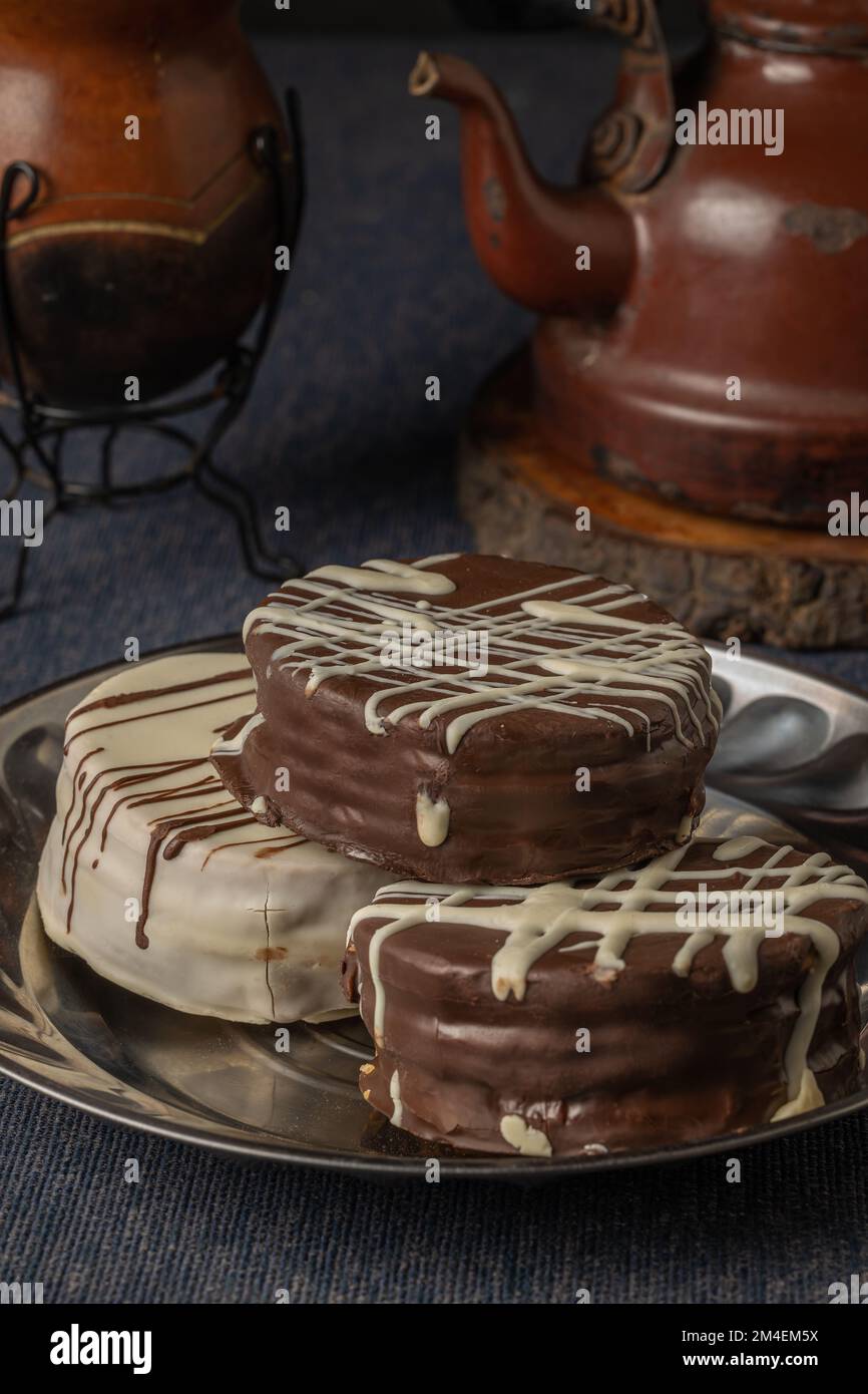 Alfajores, typical candy in Argentina, with yerba mate and a kettle ...