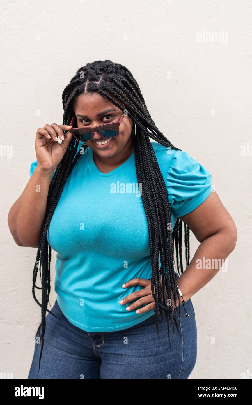 black woman with long braids and sunglasses Stock Photo - Alamy