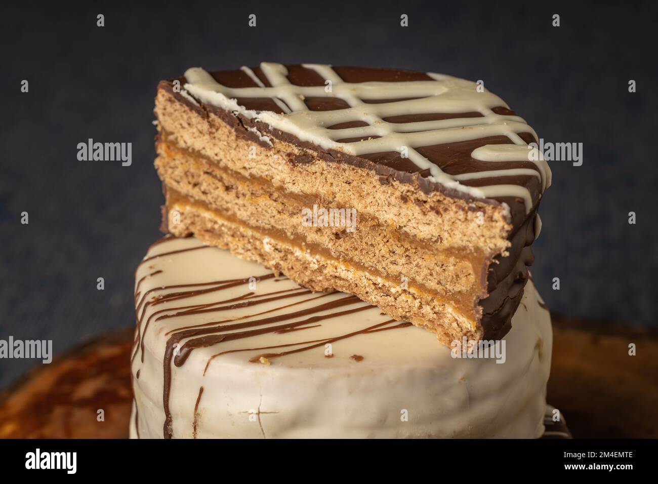 Brown chocolate alfajor cut in half, typical candy from Argentina Stock ...