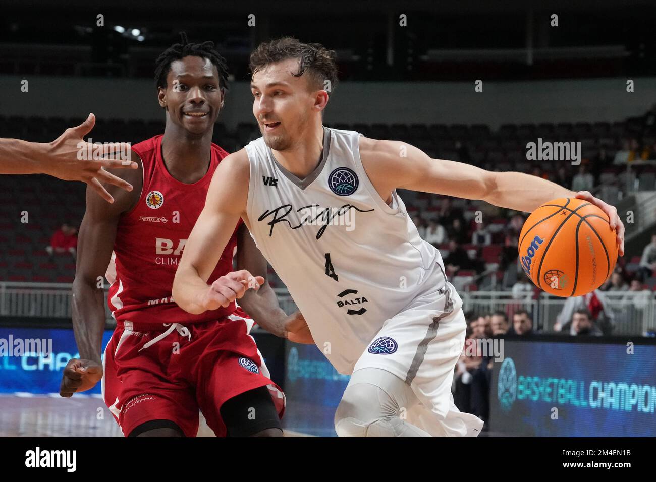 Riga, Latvia. 20th Dec, 2022. Kristers Zoriks (R) of VEF Riga vies with ...