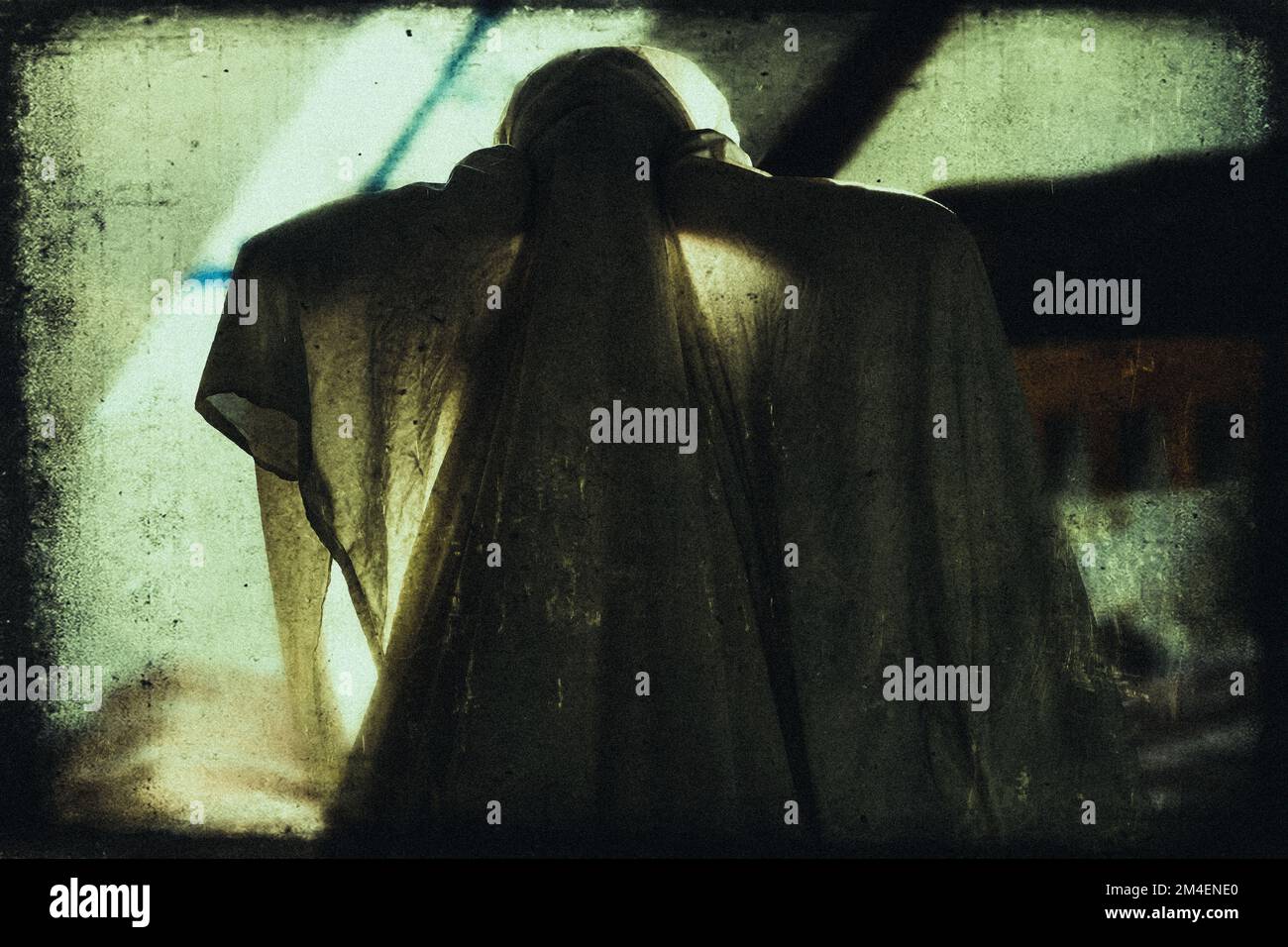 A dark horror concept. Of a haunted ghostly figure silhouetted against ...