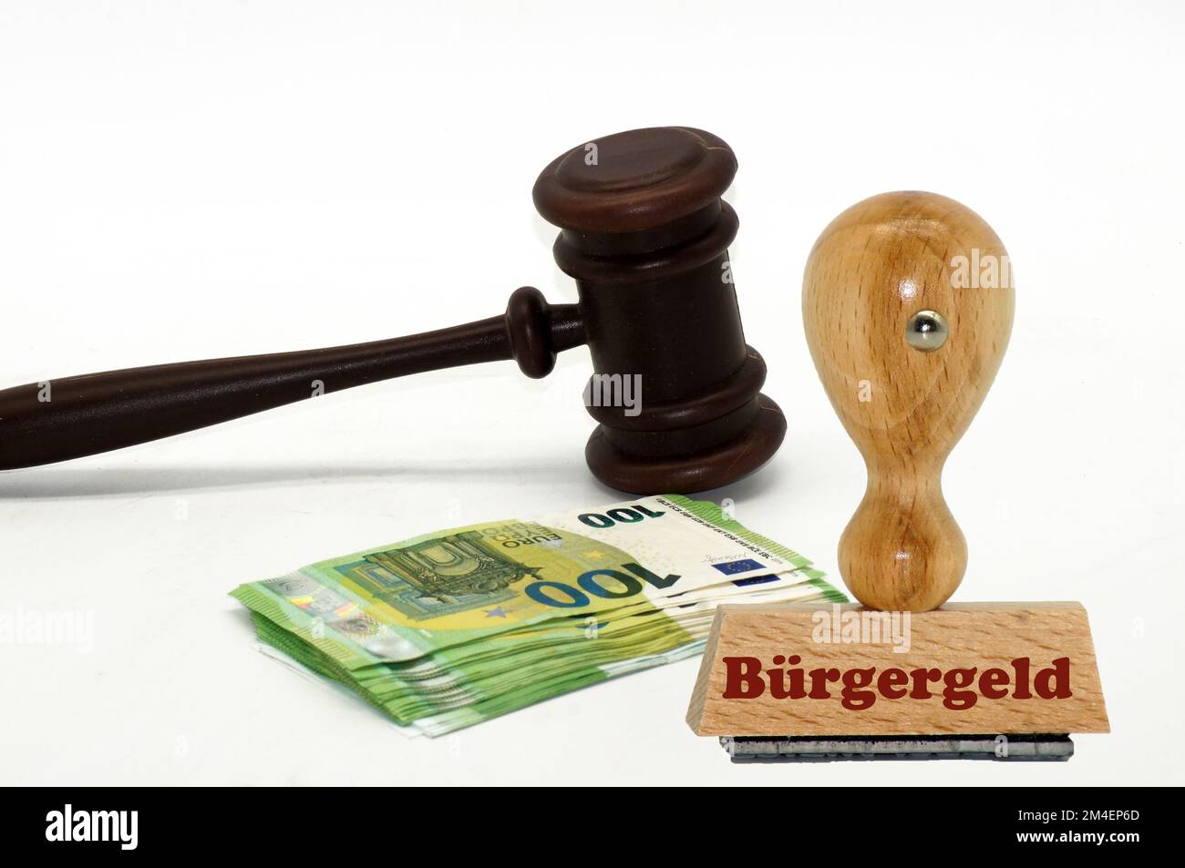 A horizontal shot of a wooden stamp, citizen money and a judge's dark ...