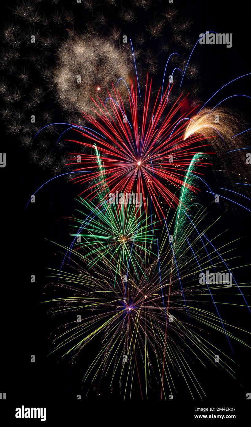 Fireworks Bursting Colors In The Night Stock Photo - Alamy
