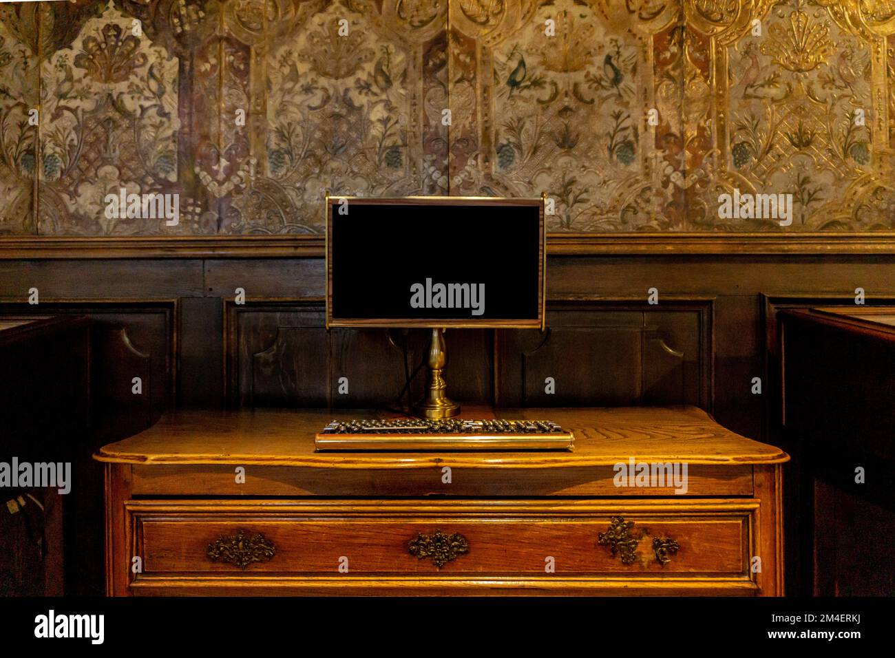A closeup view of a baroque-style computer on an antique drawer Stock ...
