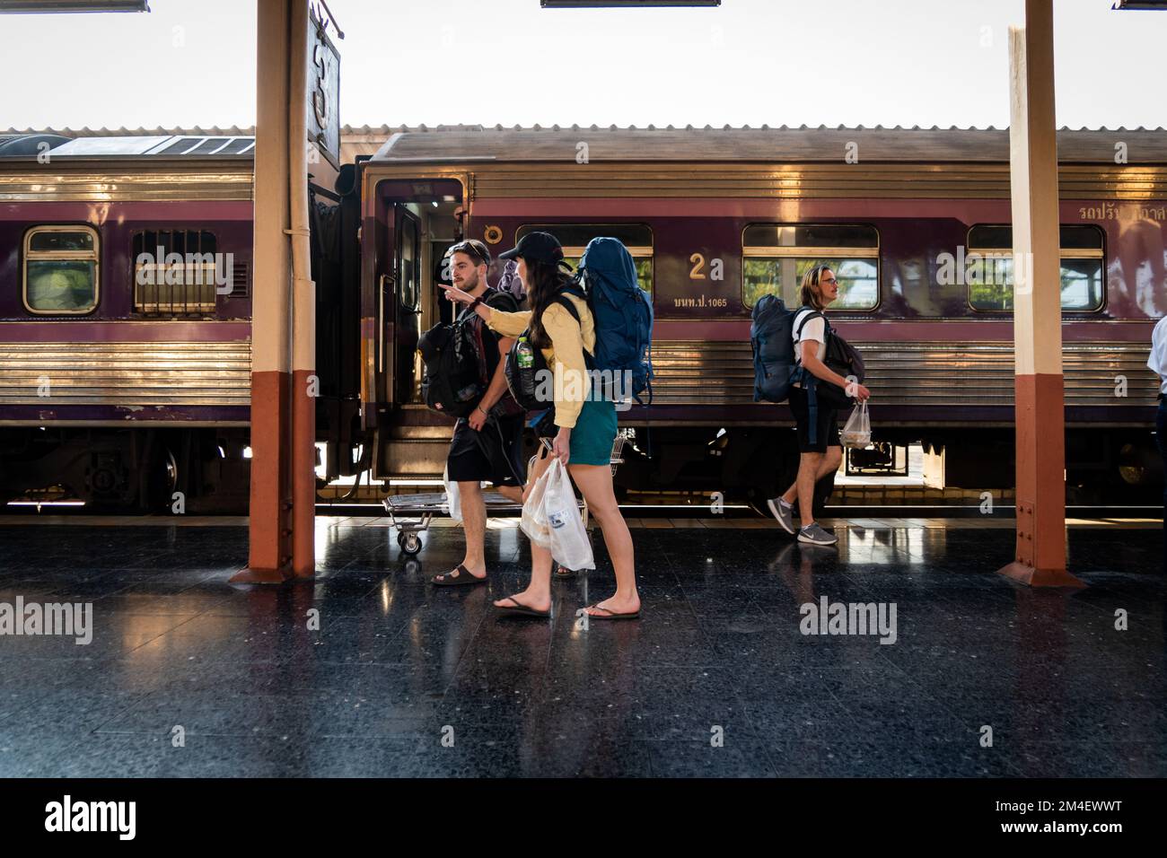 Backpackers look for their seat before boarding at Chiang Mai Railway ...