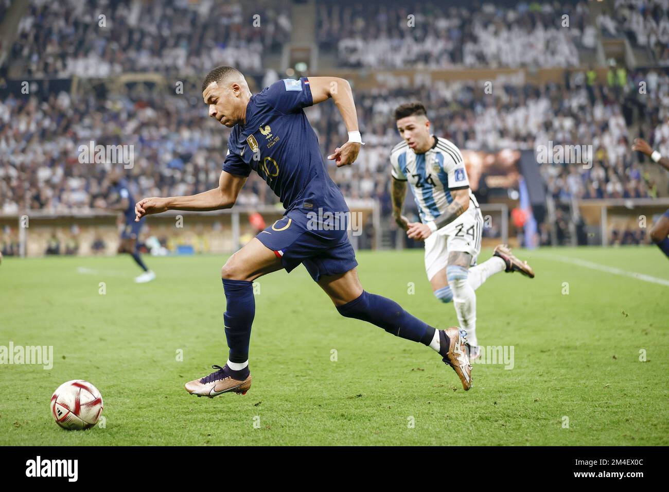France's Kylian Mbappe (front) controls the ball during the second half ...